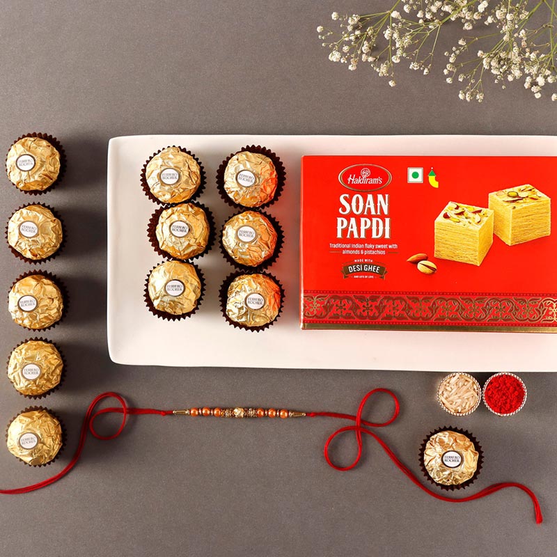 Send Sneh Rose Gold Rakhi With Soan Papdi & Ferrero Rocher Online ...